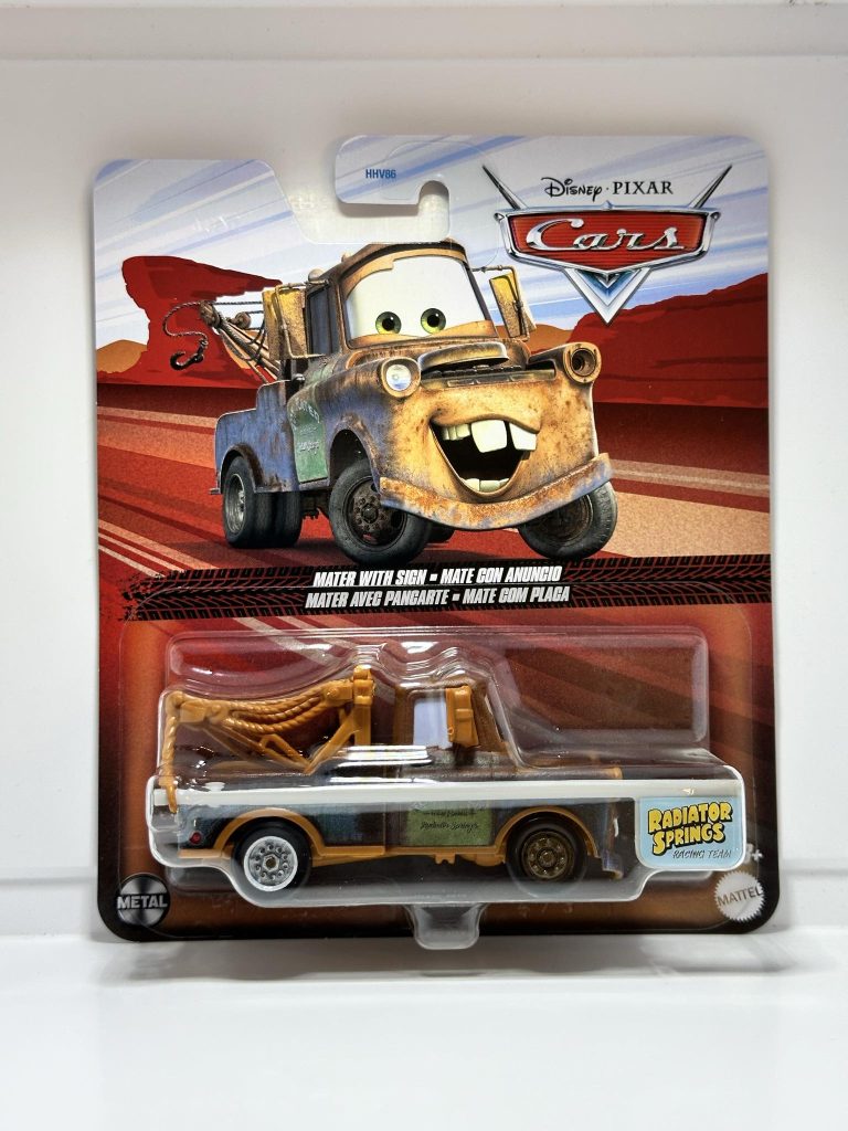Mater with Sign - Disney Pixar Cars · Distribution Diecast64